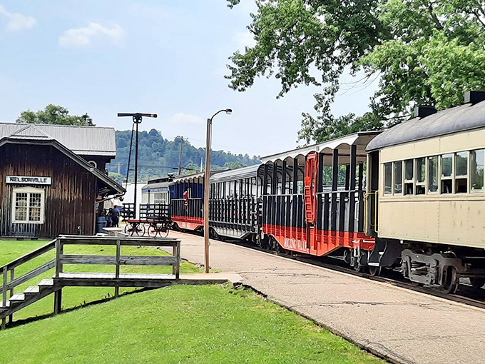 Engine #5833 stands proudly at Nelsonville Depot, like a navy-blue sentinel with golden trim guarding the gateway to Ohio's railway past.