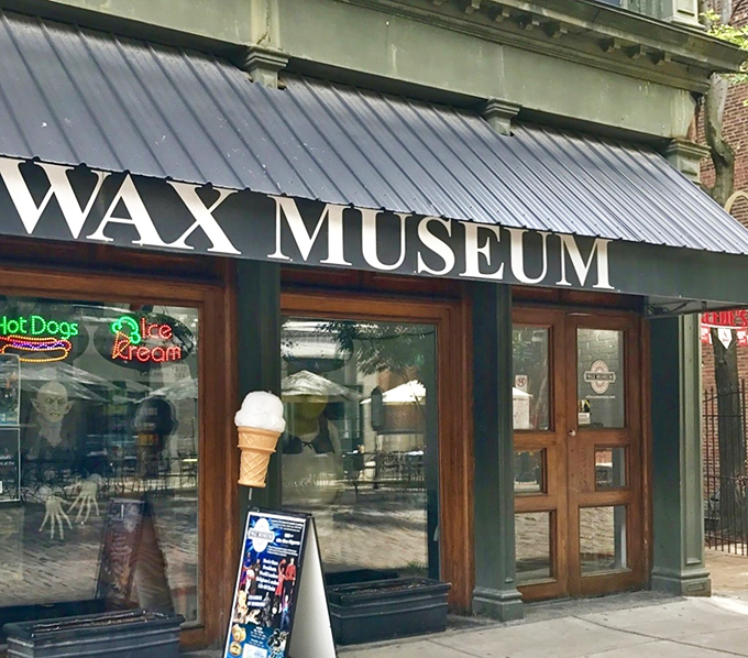 The unassuming storefront beckons with vintage charm and neon promises. Hot dogs and ice cream signs hint at the delightful oddities waiting inside.