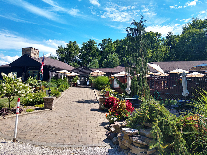 A brick pathway lined with vibrant flowers leads to wine country paradise. Ohio's European escape awaits at the end of this inviting entrance.