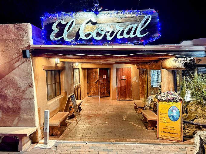 The entrance to El Corral feels like stepping onto a Western movie set, complete with towering saguaros standing guard like desert sentinels.