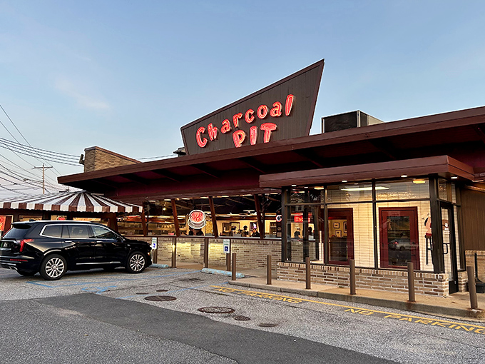 The iconic angular roof and vintage signage of Charcoal Pit stands as a beacon to burger lovers across Delaware. Time travel never tasted so good.