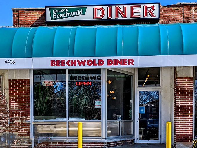 The classic diner facade that promises breakfast magic &ndash; sometimes the best treasures hide behind humble brick walls.