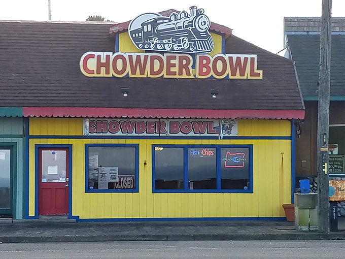 The cheerful red and yellow exterior of Chowder Bowl stands out like a beacon of comfort food hope along Oregon's coastal highway.