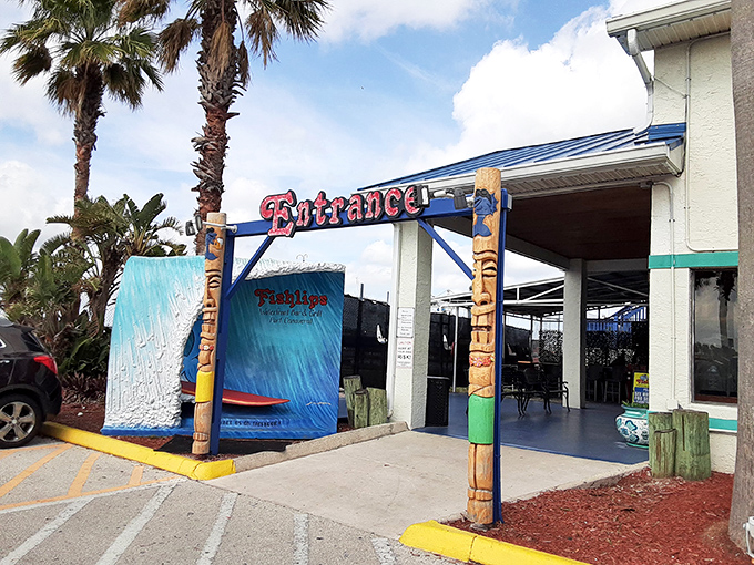 Welcome to paradise, where the entrance promises seafood adventures and the palm trees whisper "you're on vacation now."