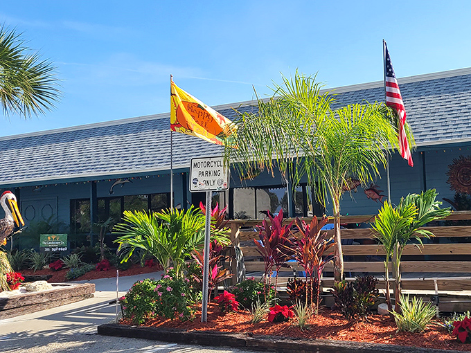 The tropical blue exterior of Our Deck Down Under welcomes seafood lovers with palm trees and Florida charm. Paradise found under a bridge!