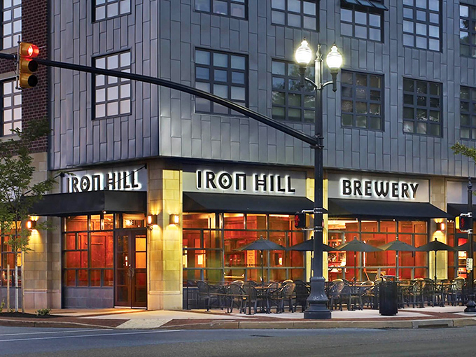 The corner spot that beckons like an old friend. Iron Hill's welcoming exterior promises good times and even better food waiting just beyond those doors.