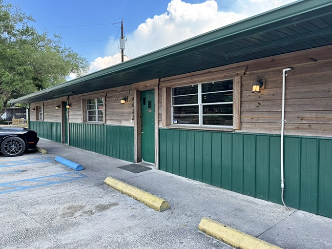 That green and wood exterior whispers "hidden gem" louder than a tourist trap billboard ever could.