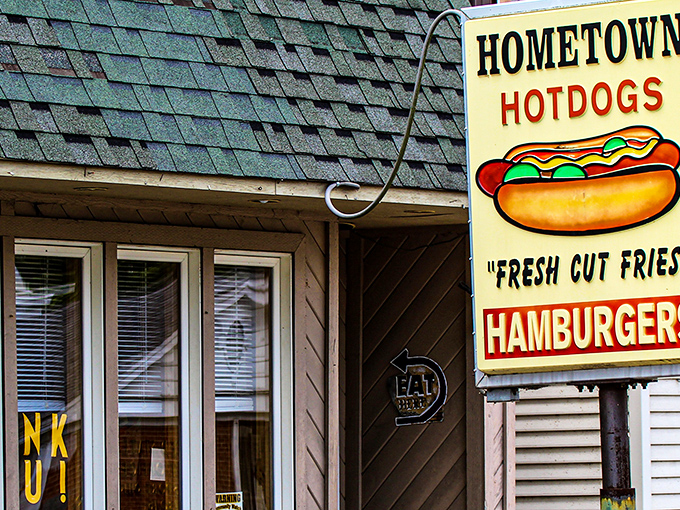 The unassuming exterior of Hometown Hot Dogs proves once again that culinary treasures often hide behind the most modest facades. Christmas lights in July? Why not!