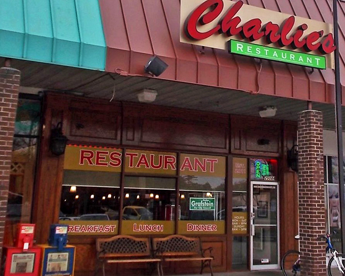 The iconic red Charlie's sign beckons hungry travelers like a lighthouse for the famished. Classic diner charm with zero pretension.