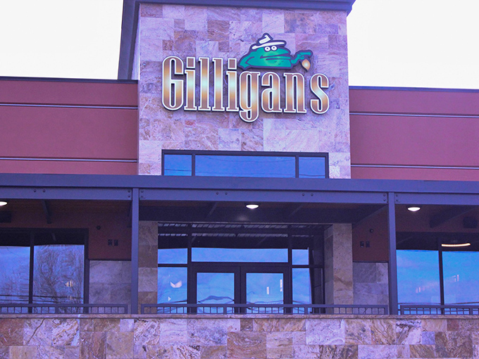 Gilligan's welcoming exterior promises culinary adventures ahead, with stone fa&ccedil;ade and bright red planters setting the stage for what's inside.