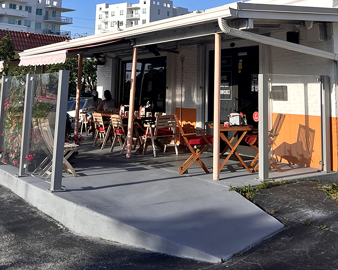 The red awning beckons like a Parisian postcard, promising culinary treasures behind those doors. Florida sunshine meets French charm at this unassuming strip mall gem.