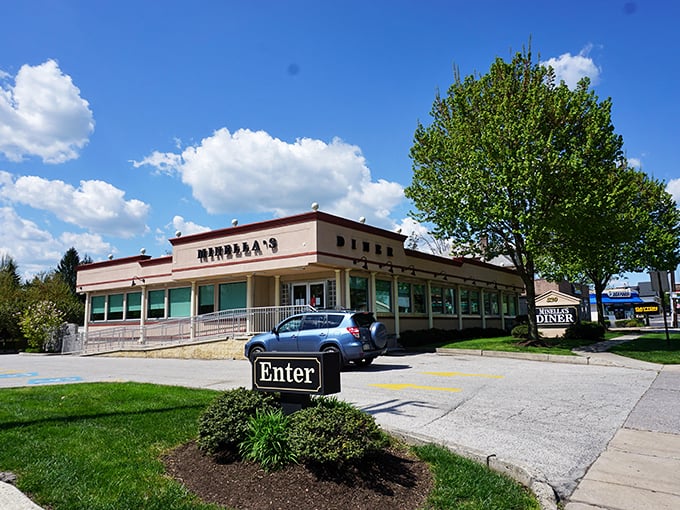 Minella's classic diner exterior stands like a beacon of breakfast hope on Lancaster Avenue, promising comfort food salvation to hungry Wayne residents.