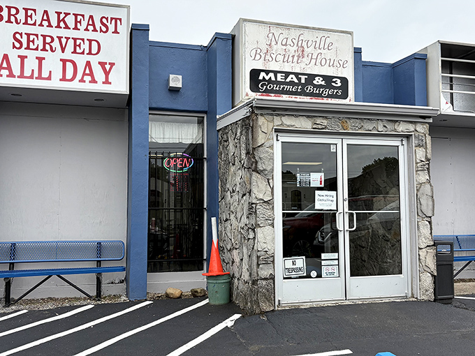 The unassuming blue facade of Nashville Biscuit House promises breakfast treasures within. Like finding a secret jazz club, the real magic happens once you step inside.