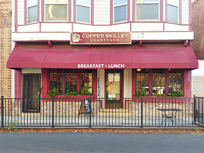 The burgundy awning of Copper Skillet Courtyard beckons like an old friend on Martinez's Main Street, promising comfort food that transcends trendy culinary fads.