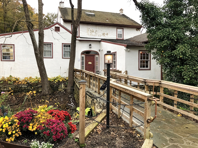 The charming exterior of Butterscotch Pastry Shop feels like stumbling upon a secret clubhouse for carb enthusiasts. The wooden footbridge practically whispers, "Worthy treats await."