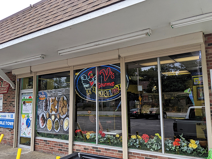 The unassuming storefront of V's Gourmet Chicken might not look like a culinary destination, but those neon lights beckon like a beacon to fried chicken aficionados.