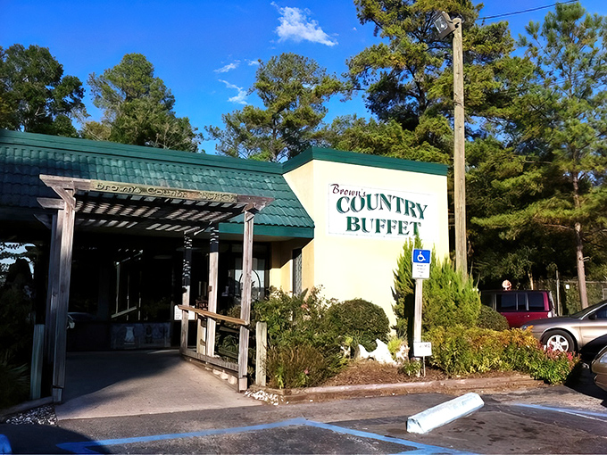 The unassuming exterior of Brown's Country Buffet stands like a beacon of hope for hungry travelers. That orange-tiled roof practically whispers, "Come get comfortable."