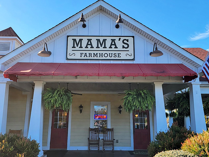 The classic white farmhouse exterior with its inviting porch and rocking chairs isn't just architecture&mdash;it's a promise of the comfort waiting inside.