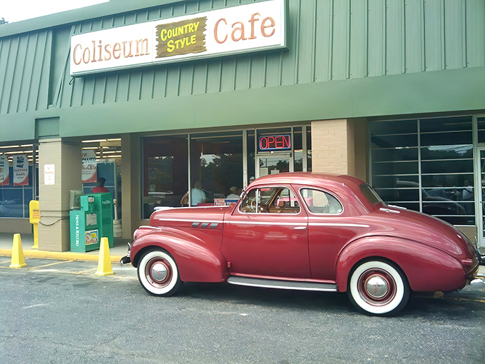 Classic Americana at its finest! The vintage car parked outside Coliseum Country Cafe perfectly complements this unassuming Greensboro treasure where culinary magic happens daily.
