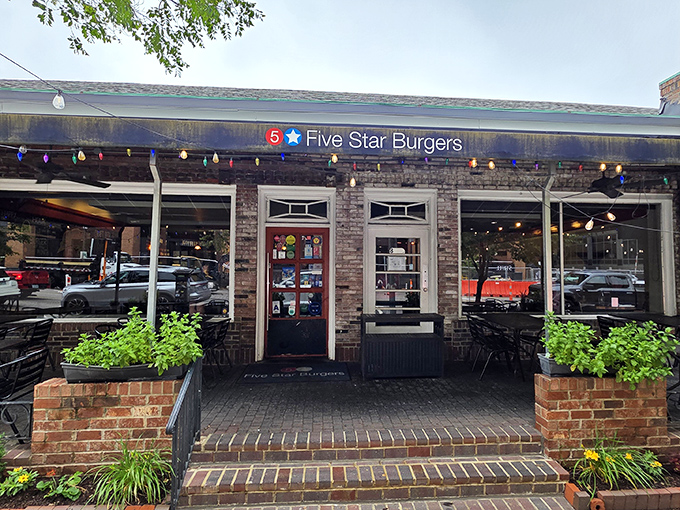 The charming brick exterior of 5 Star Burgers beckons like an old friend with a delicious secret. String lights add that perfect touch of "come on in" warmth.