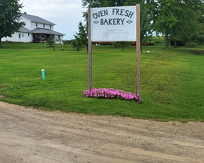The unassuming exterior of Oven Fresh Bakery in Markesan hides culinary treasures that draw pilgrims from across Wisconsin. Those rocking chairs aren't just for show.
