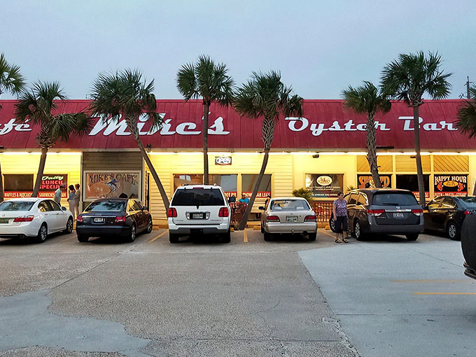 Mike's iconic red roof stands out like a culinary lighthouse, beckoning hungry travelers with the promise of seafood treasures within.