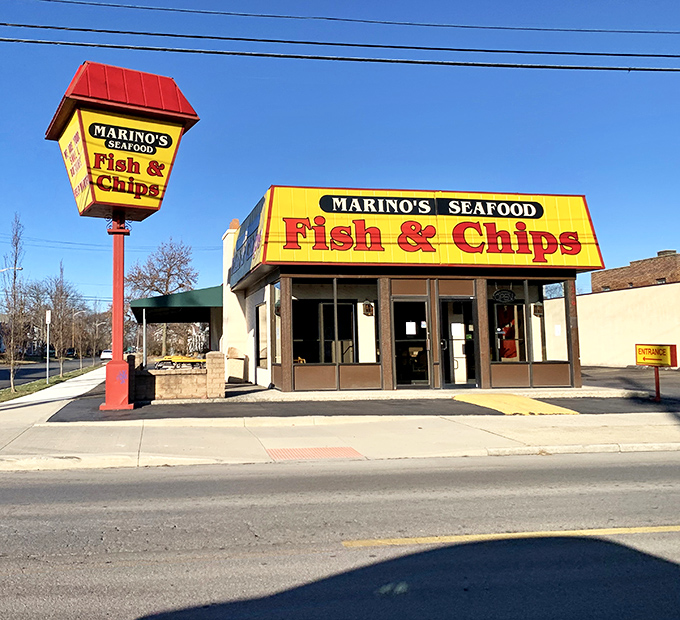 The bright yellow building with its iconic red roof stands like a beacon of fried seafood goodness in Columbus. No pretense, just promise.