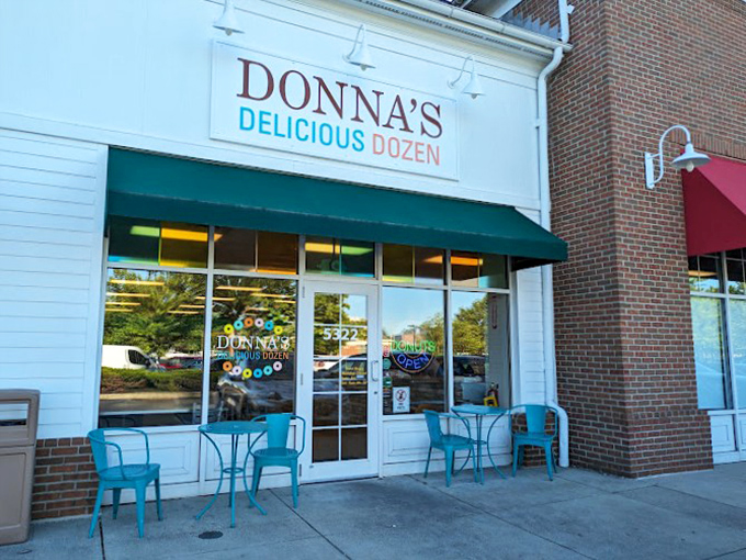 The white storefront with its cheerful teal accents beckons like a sugar-coated siren call to donut lovers across Columbus.