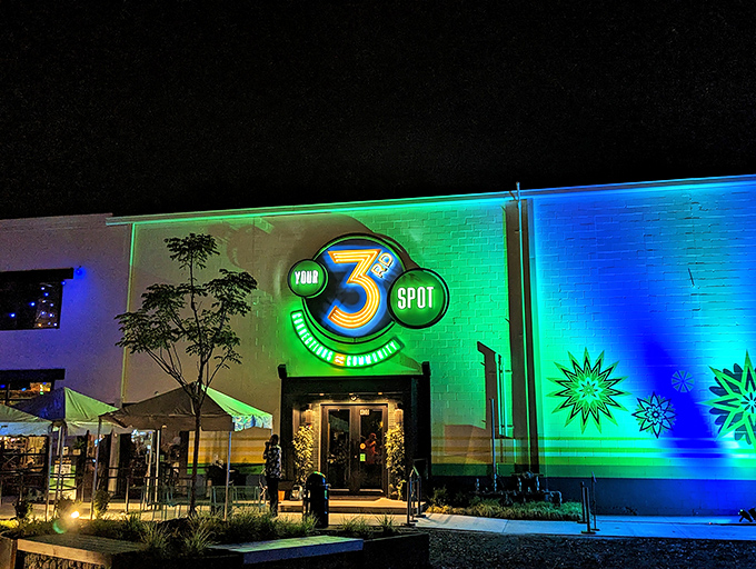 The neon-lit exterior of Your 3rd Spot glows like a beacon for fun-seeking adults. Green and blue hues transform this Atlanta hotspot into a playground after dark.