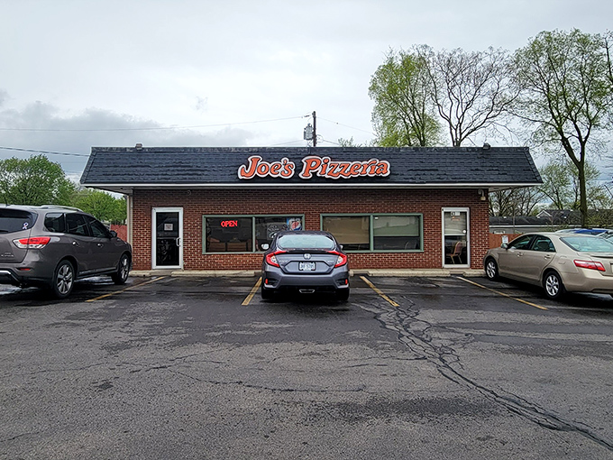 The unassuming brick fortress of flavor that is Joe's Pizzeria stands proudly on Airway Road, a beacon to pizza pilgrims for over six decades.