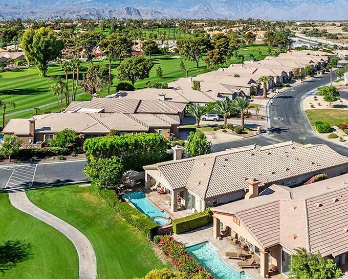 Terra cotta rooftops stretch like a warm blanket across Palm Desert Country Club, where retirement dreams don't require a millionaire's bank account.