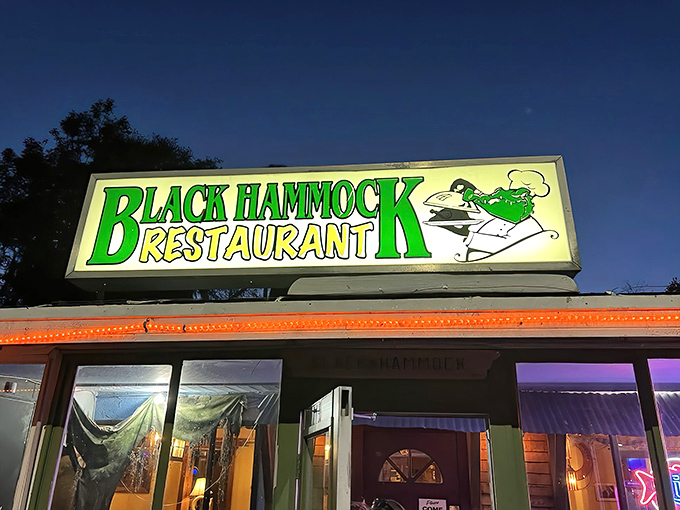 The glowing green sign of Black Hammock Restaurant beckons like a neon lighthouse for hungry travelers. Florida dining doesn't get more authentic than this Oviedo landmark.