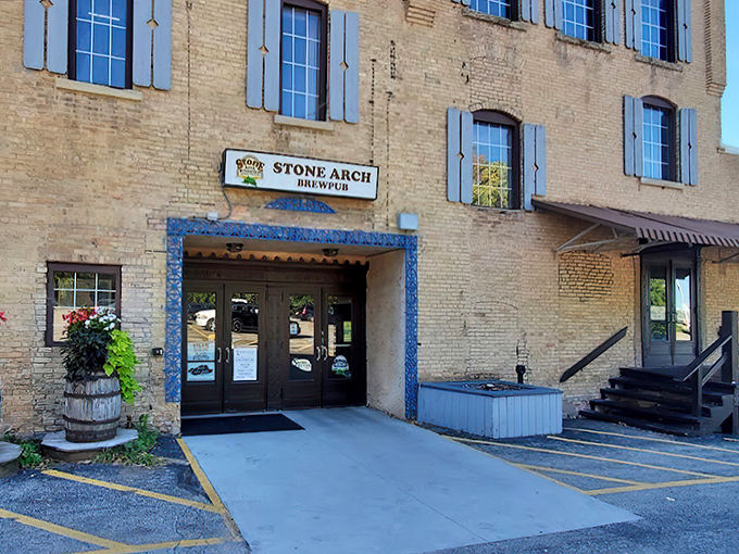 Stone Arch Brewpub's historic brick exterior stands proudly in Appleton, those blue shutters like a wink saying, "Yes, we've got stories to tell and brews to share."
