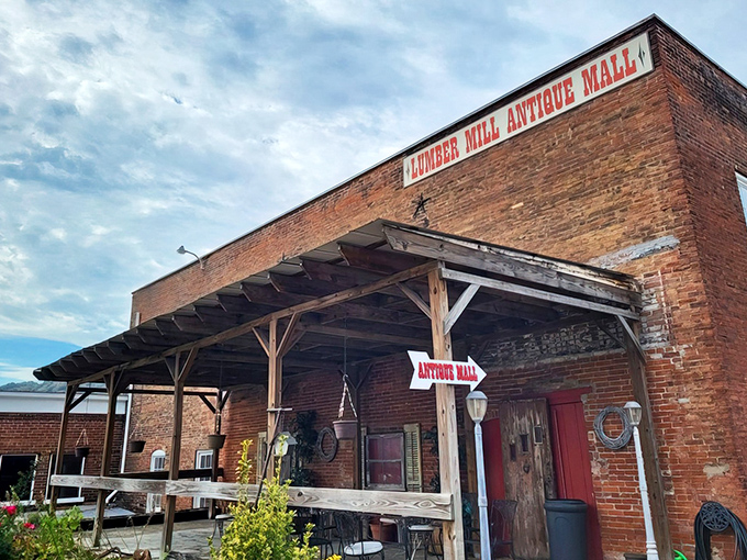The historic brick facade of Lumber Mill Antique Mall stands proudly in Madison, a time capsule disguised as a building. If walls could talk, these would tell you to come inside and browse awhile.