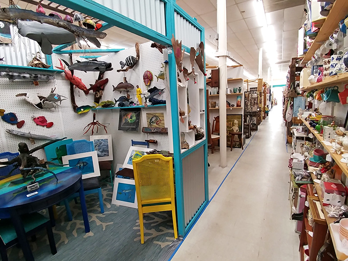 The blue sign beckons like a portal to the past. Palm trees stand guard outside this treasure trove of memories waiting to be rediscovered.