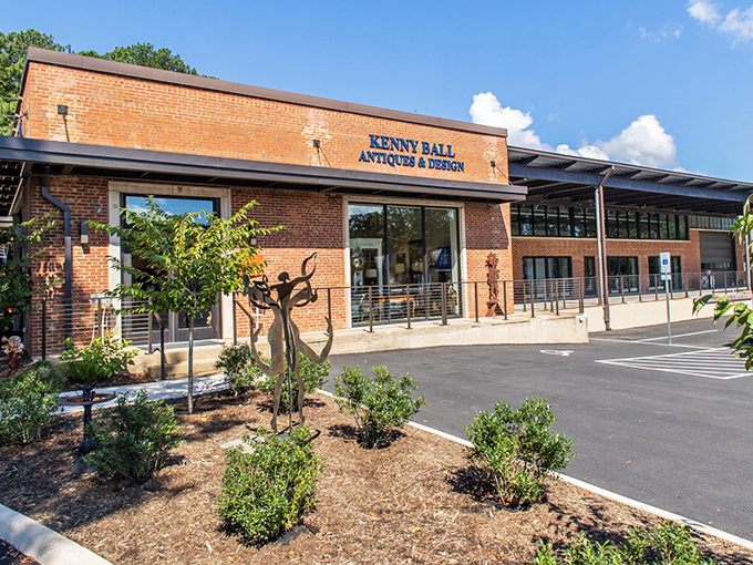 The brick fa&ccedil;ade of Kenny Ball Antiques beckons like a time portal disguised as a charming storefront. History awaits inside!