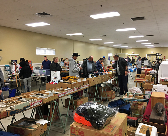 Treasure hunters navigate the indoor aisles at Berea Flea Market, where one person's forgotten knickknack becomes another's prized possession.