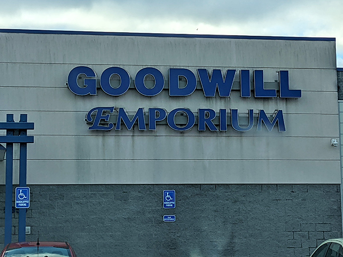 The Goodwill Emporium stands like a blue-signed beacon against the Michigan sky, promising treasure hunters their next great find at sunset. 