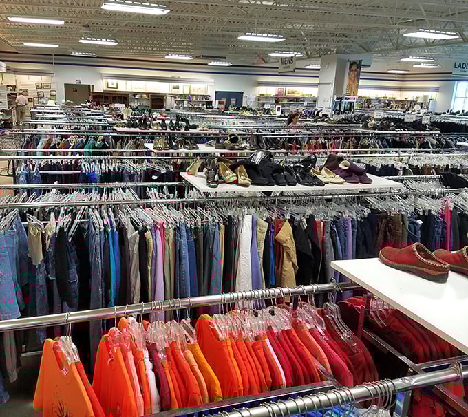 The unassuming exterior of Palmetto Goodwill belies the treasure trove within. That blue roof signals bargain paradise to seasoned thrifters.