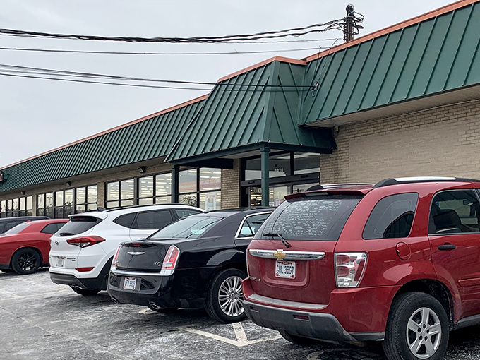 The green-roofed bargain paradise beckons with its bold red signage, promising treasures that won't empty your wallet. Thrift nirvana awaits!