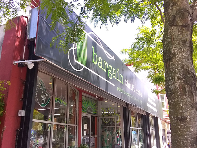 The iconic green and black storefront of Bargain Thrift Center beckons with promises of treasures waiting to be discovered inside.