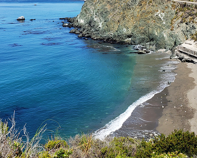Nature's perfect balancing act: the turquoise waters of the Pacific meet a secluded cove at Limekiln State Park, where dramatic cliffs create a postcard-worthy backdrop.