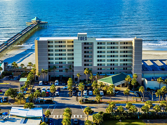 The iconic Folly Beach Pier stretches into the Atlantic like nature's welcome mat. From above, you can see why locals call this slice of paradise "The Edge of America."