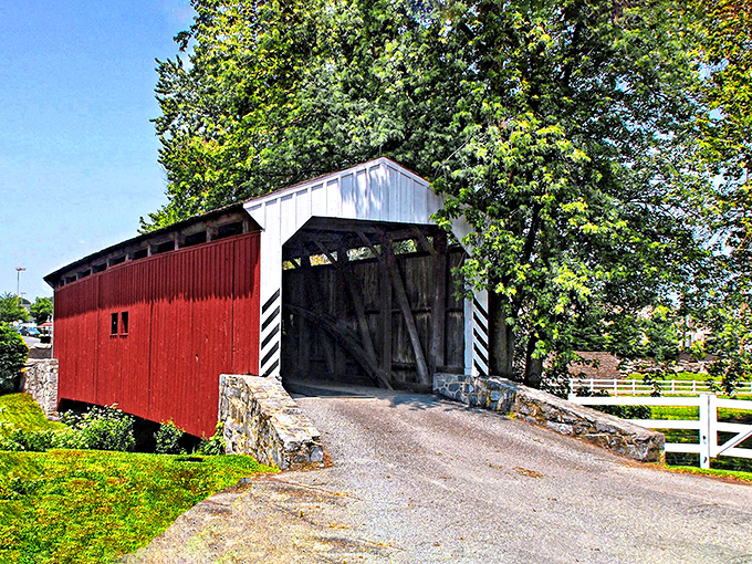 The classic red siding and white-trimmed entrance of Willow Hill Covered Bridge create that quintessential Pennsylvania postcard moment you'll want to frame.