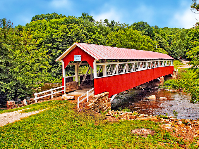 The classic red exterior of Barronvale Bridge stands in perfect contrast to the lush greenery, like a Norman Rockwell painting come to life.