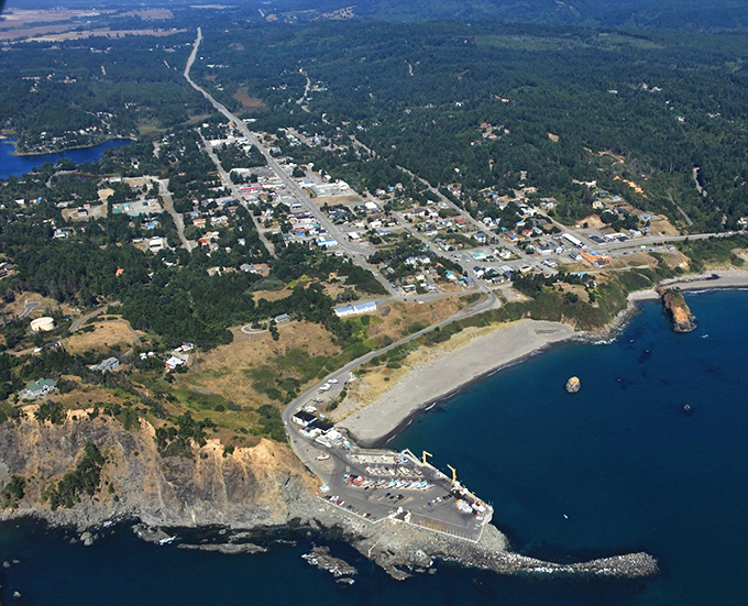 Port Orford from above looks like nature decided to create the perfect postcard&mdash;complete with dramatic headlands, a working harbor, and a town that refuses to be ordinary.