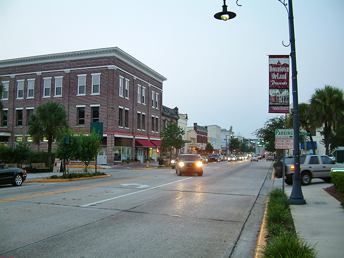 Downtown DeLand at dusk, where historic brick buildings and vintage lampposts create the perfect backdrop for an evening stroll. Small-town America at its finest.
