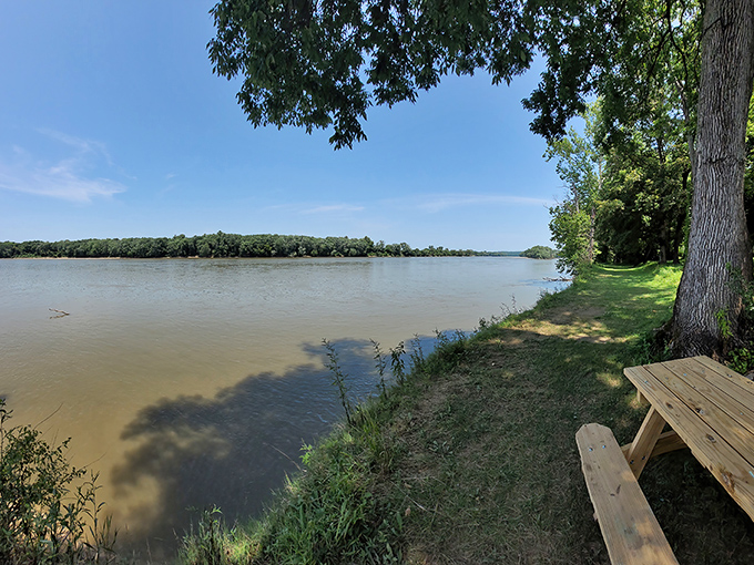 The Wabash River flows lazily past Harmonie State Park, reflecting clouds like nature's own Instagram filter. Pure Indiana serenity.