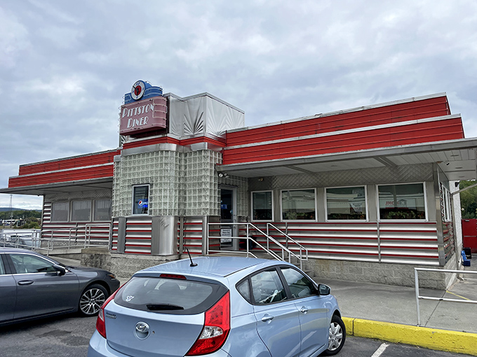 The classic red and chrome exterior of Pittston Diner stands like a time machine to the 1950s, beckoning hungry travelers with nostalgic charm.