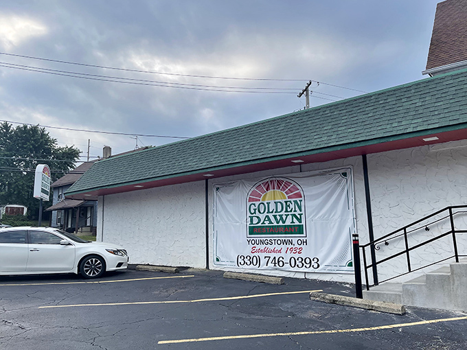 The unassuming exterior of Golden Dawn Restaurant in Youngstown hides culinary treasures that locals have treasured for generations. Some buildings don't need to shout.